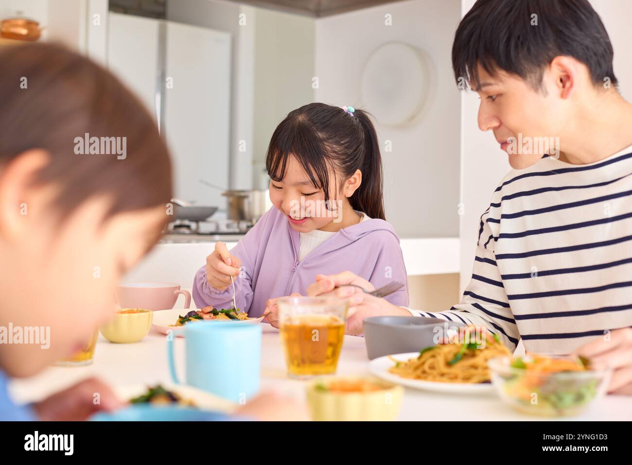Nuclear family eating meal in hi-res stock photography and images - Alamy