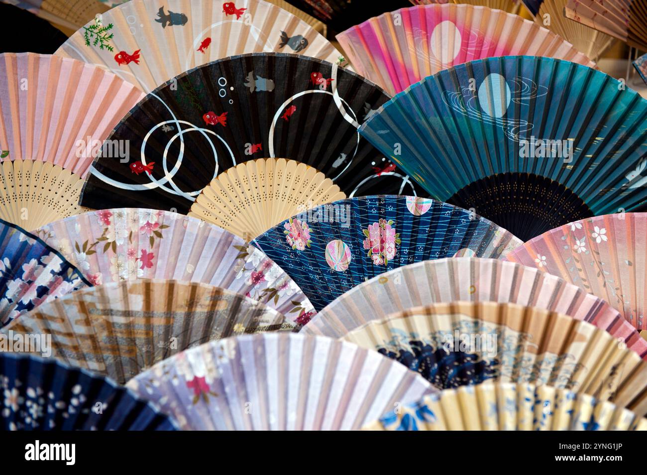 A pattern of multiple colorful folding Japanese fans, or "sensu" seen ...