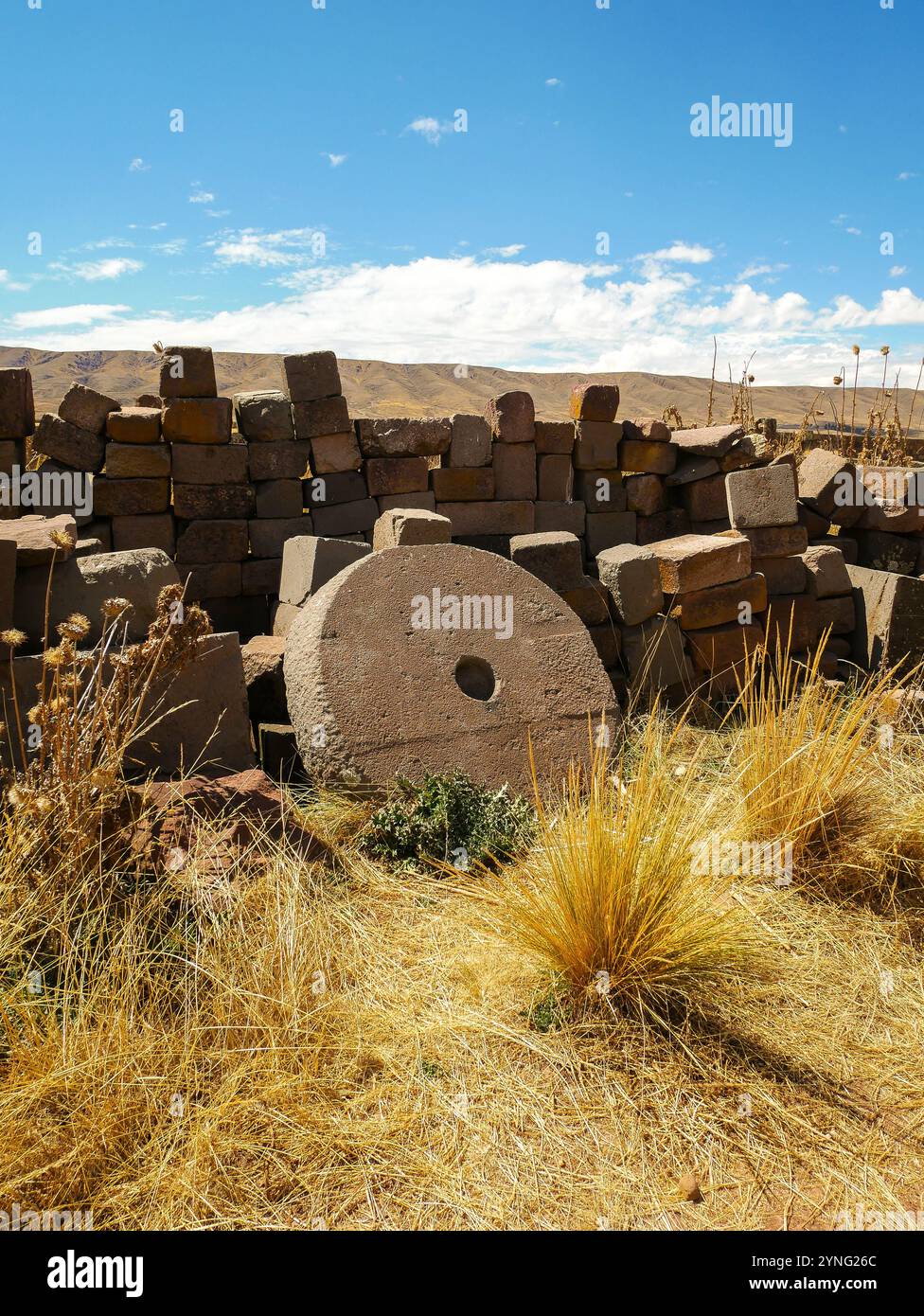 Wall of Square Stones of the Same Size and a Wheel-Shaped Stone with a ...