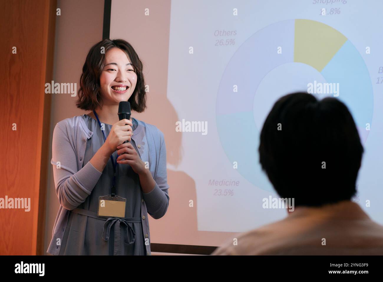 Japanese woman talking during meeting Stock Photo - Alamy