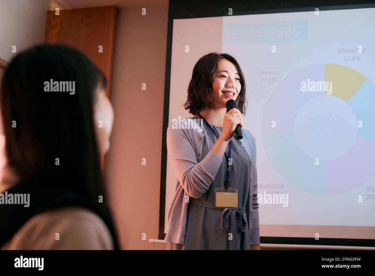 Japanese woman talking during meeting Stock Photo - Alamy