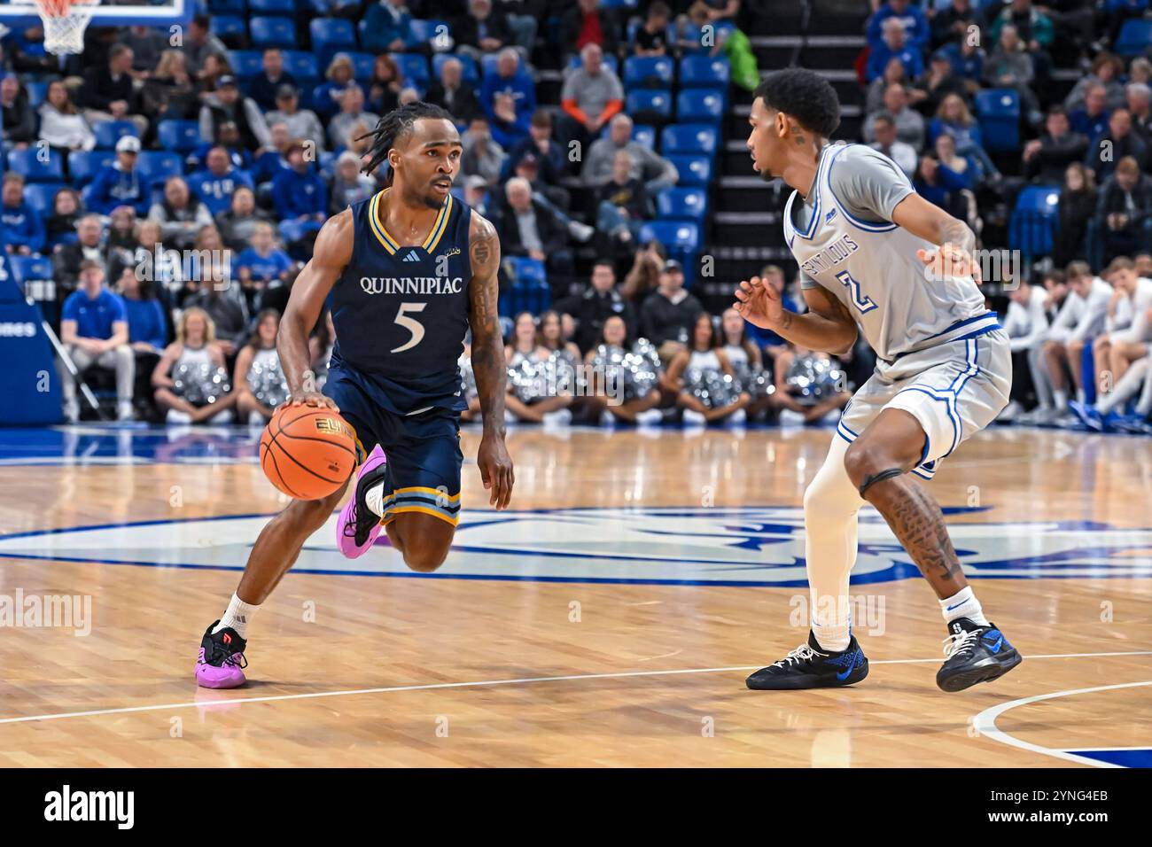 NOVEMBER 25, 2024: Quinnipiac Bobcats guard Doug Young (5) drives to ...