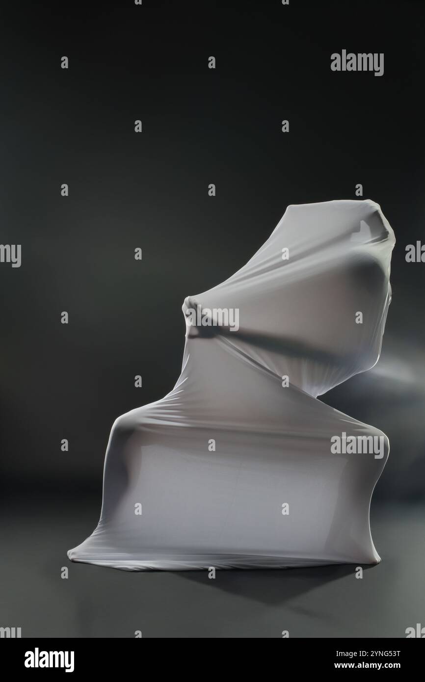 Abstract form covered with white fabric creating intriguing shapes and ...