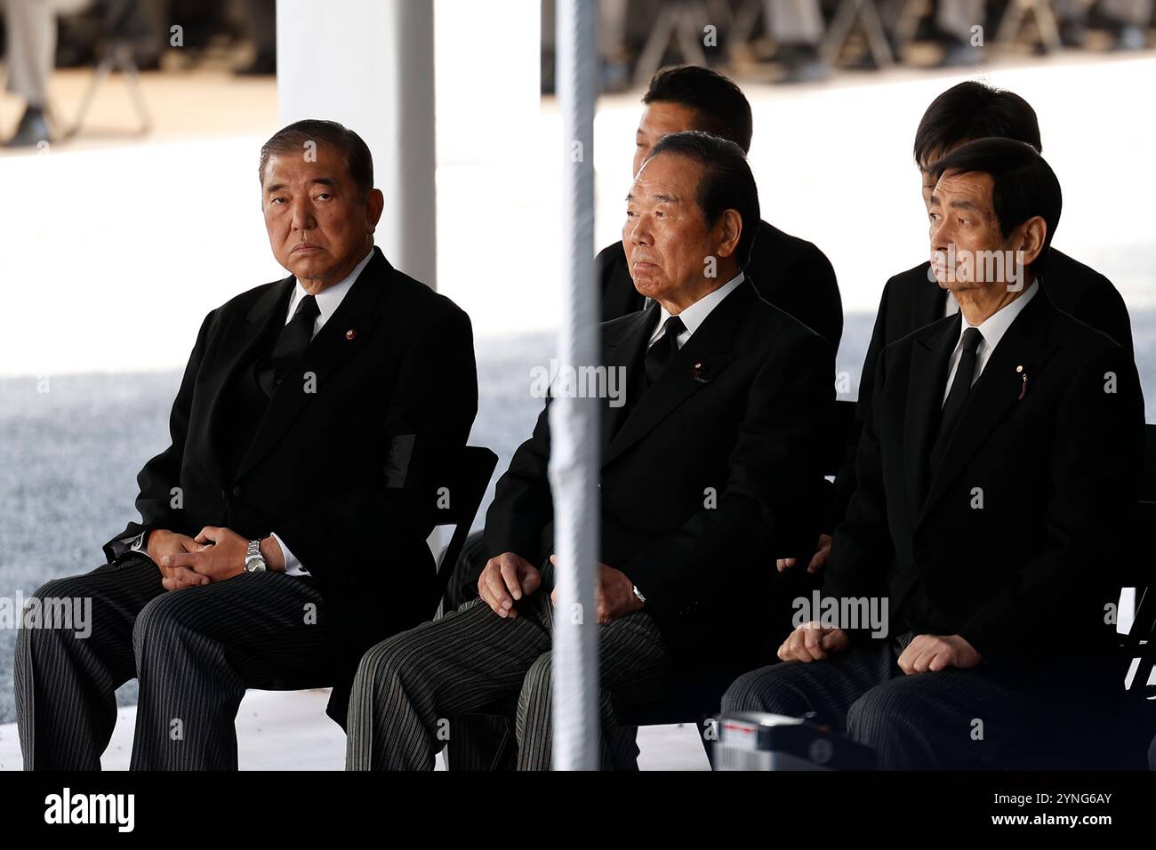 Japanese Prime Minister Shigeru Ishiba, left, attends the funeral of ...