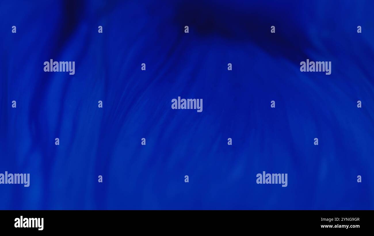 Color gel drop. Paint blend. Defocused vivid black blue pigment ...