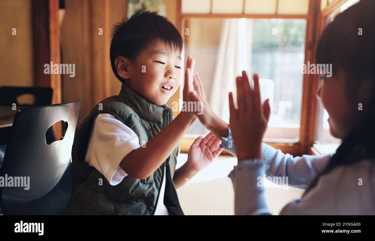 Family, children and playing clapping game for bonding, cognitive ...