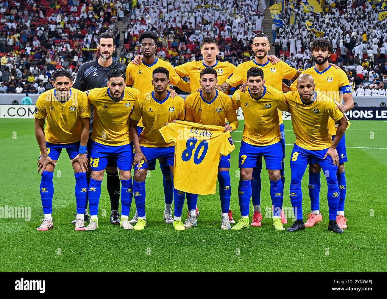 Al Khor, Qatar. 25th Nov, 2024. Players of Al Gharafa SC pose for ...