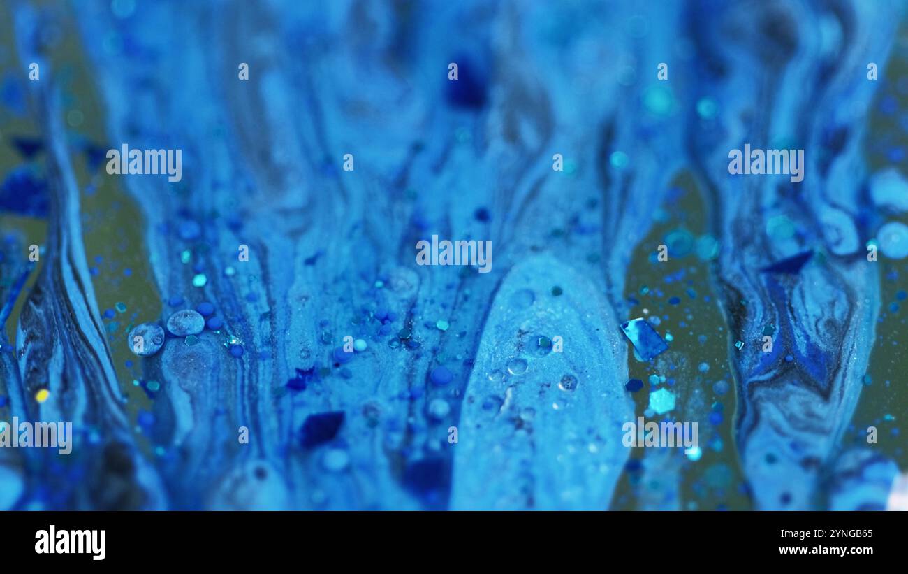 Acrylic liquid drip. Glitter paint spill. Defocused blue color shiny ...