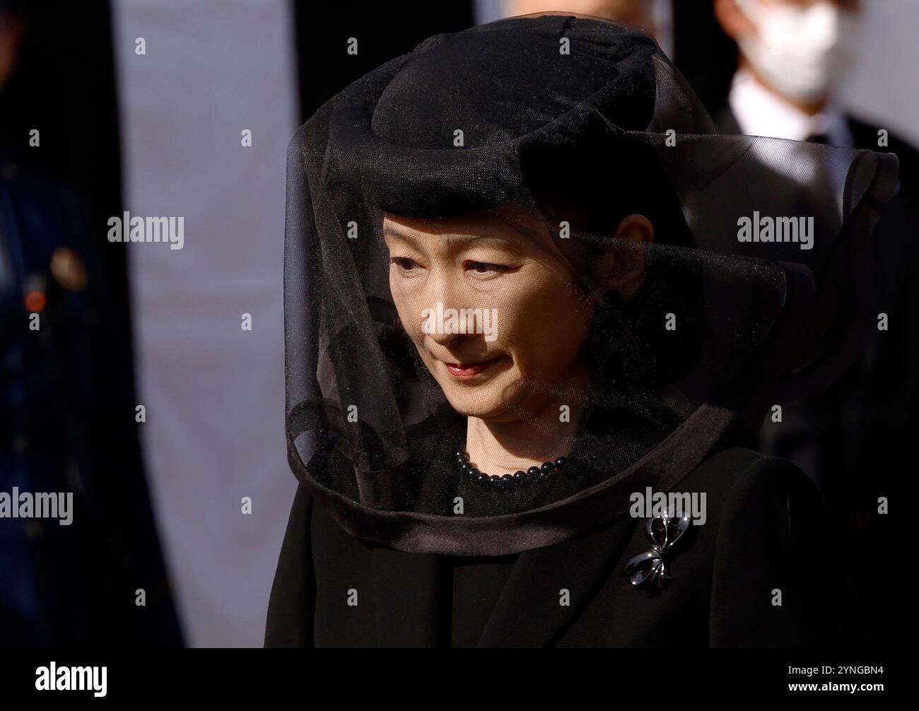 Japan's Princess Kiko walks after attending a funeral service for ...