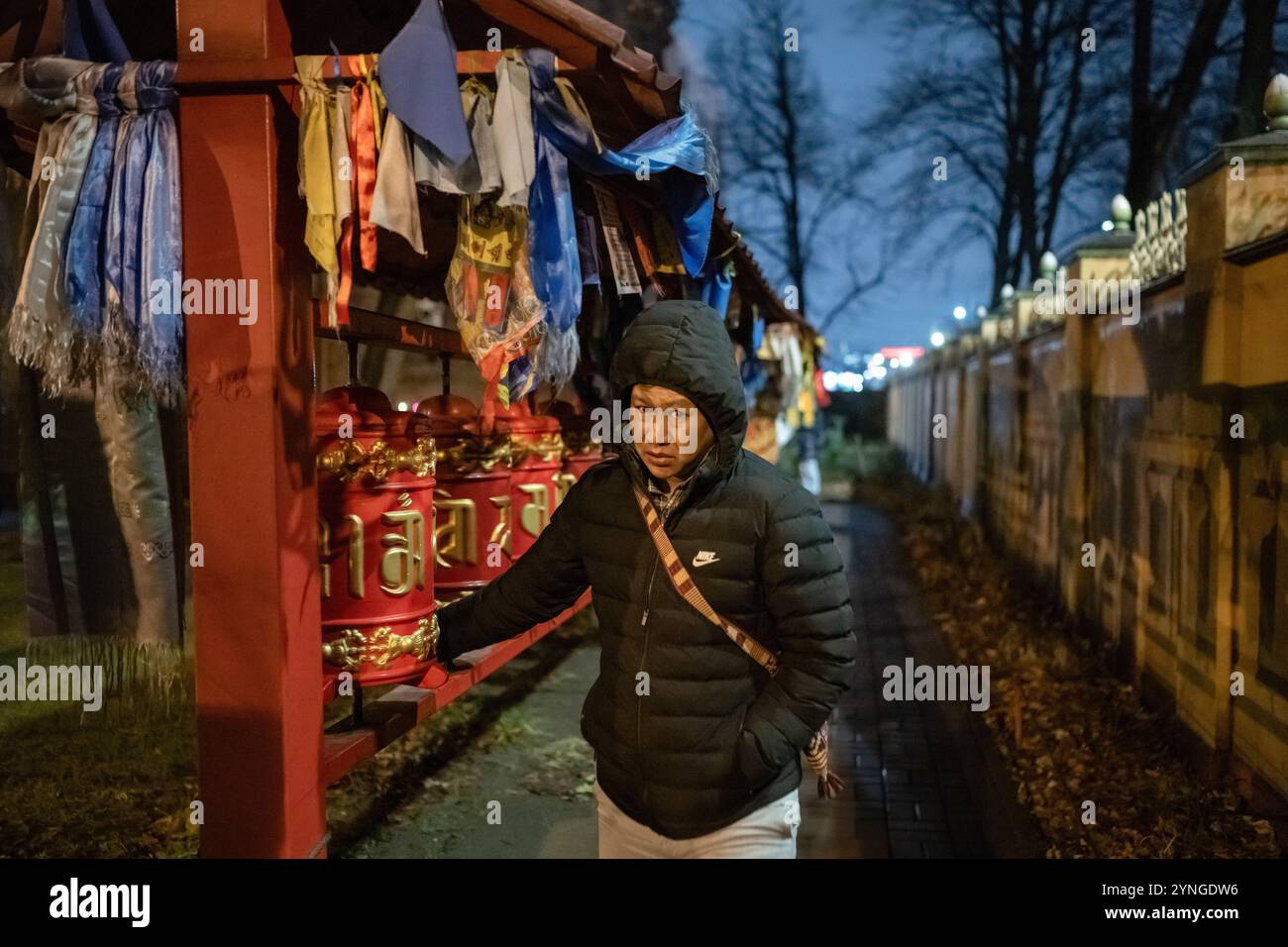 A worshipper performs a ritual circumambulation around Datsan ...