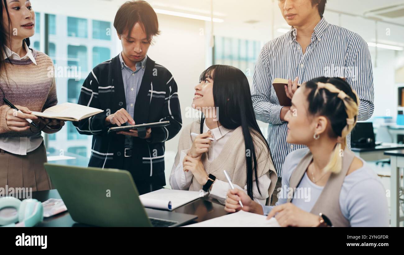 Japanese business people, group and laptop for meeting, collaboration ...