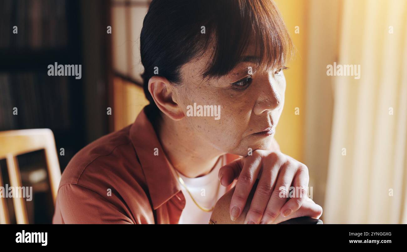 Thinking, senior and japanese woman with walking cane and sad memory ...