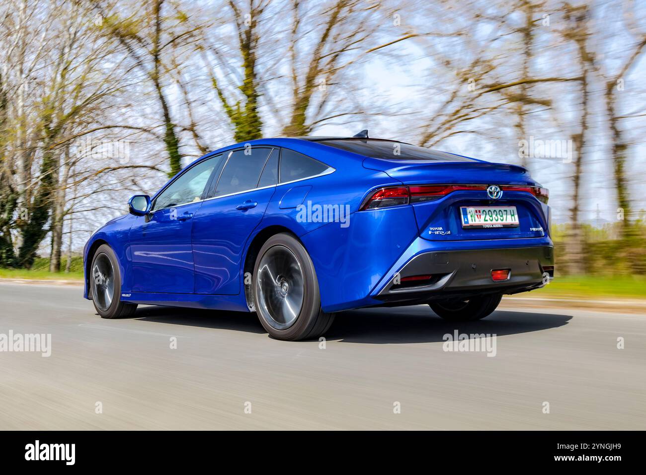 Toyota Mirai hydrogen fuel cell car on the road. Mirai combines hydrogen with oxygen from the ...