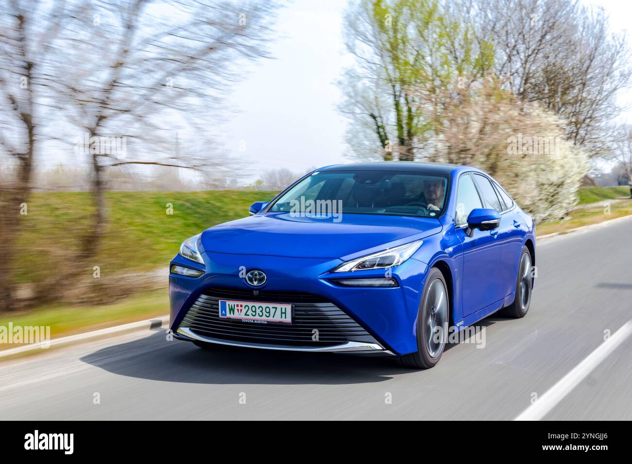 Toyota Mirai hydrogen fuel cell car on the road. Mirai combines hydrogen with oxygen from the ...