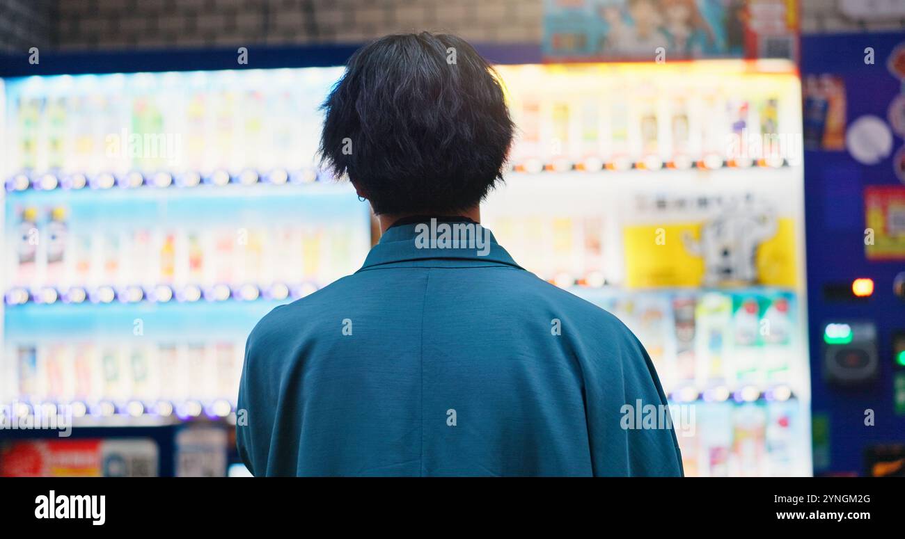 Back, vending machine and thinking with man in Japan city for food ...