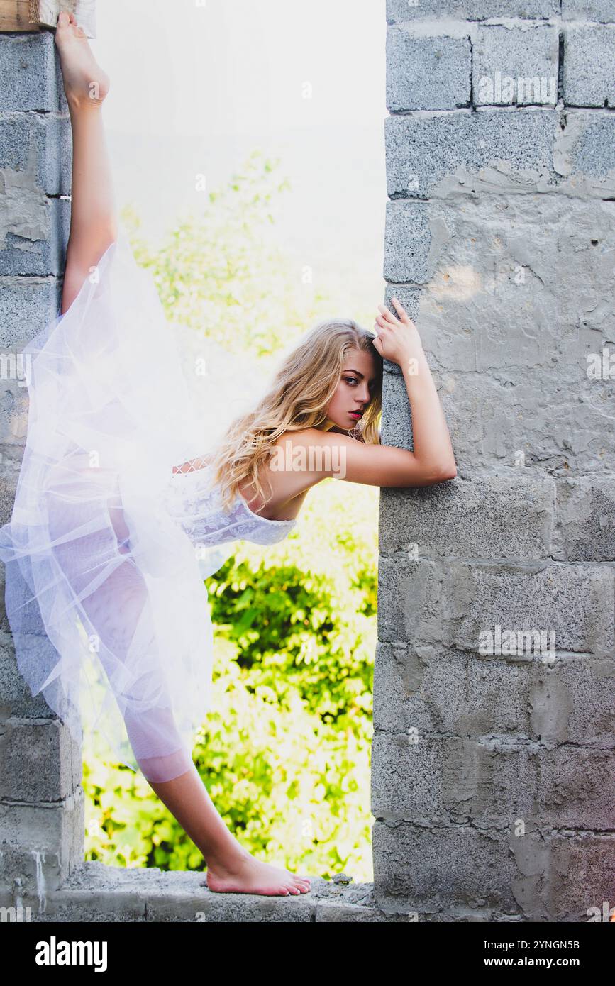 Leg-split, flexible girl doing split. Woman doing stretching up ...