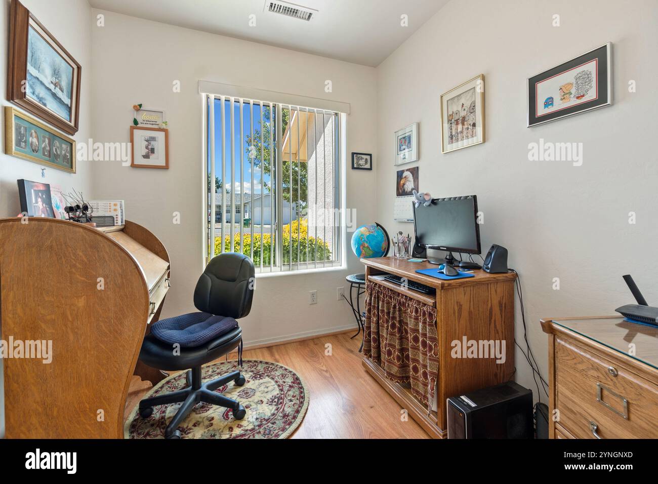 Cozy office space with natural light and personal touches in a sunny ...