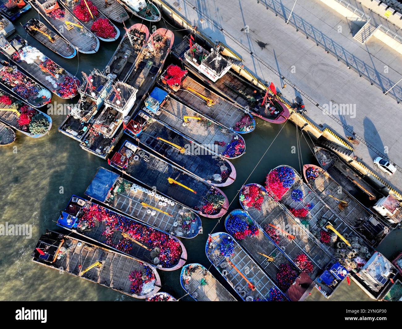 Fishing boats berth in the harbor to take shelter from the cold wave ...