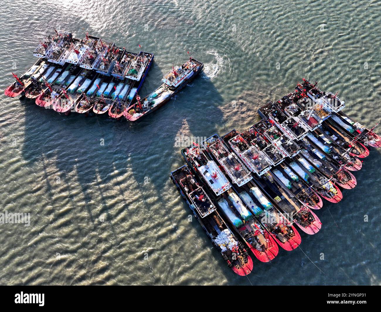Fishing boats berth in the harbor to take shelter from the cold wave ...