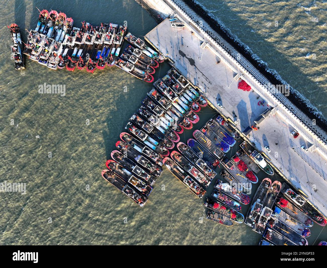 Fishing boats berth in the harbor to take shelter from the cold wave ...