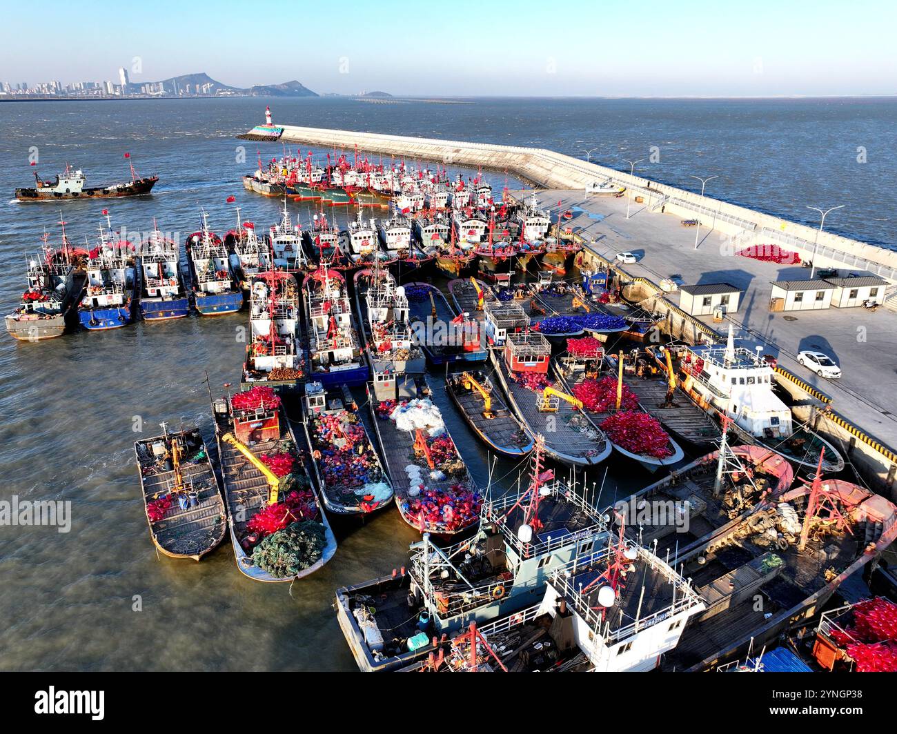 Fishing boats berth in the harbor to take shelter from the cold wave ...