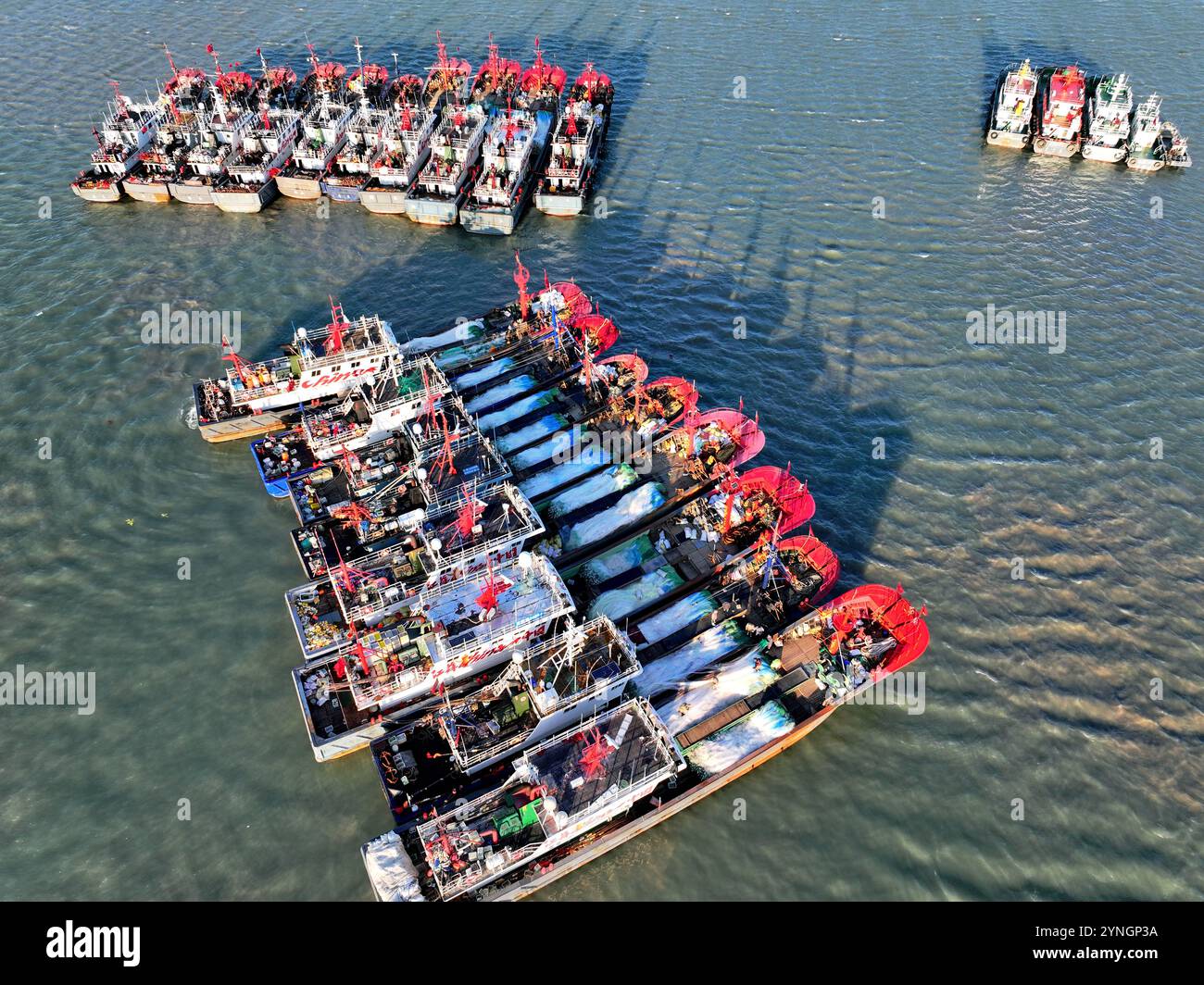 Fishing boats berth in the harbor to take shelter from the cold wave ...