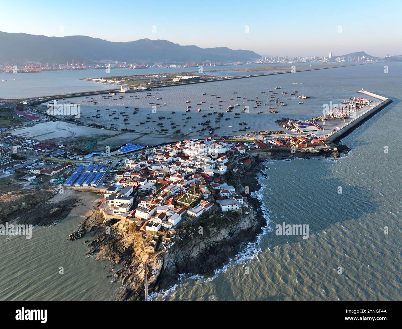 Fishing boats berth in the harbor to take shelter from the cold wave ...