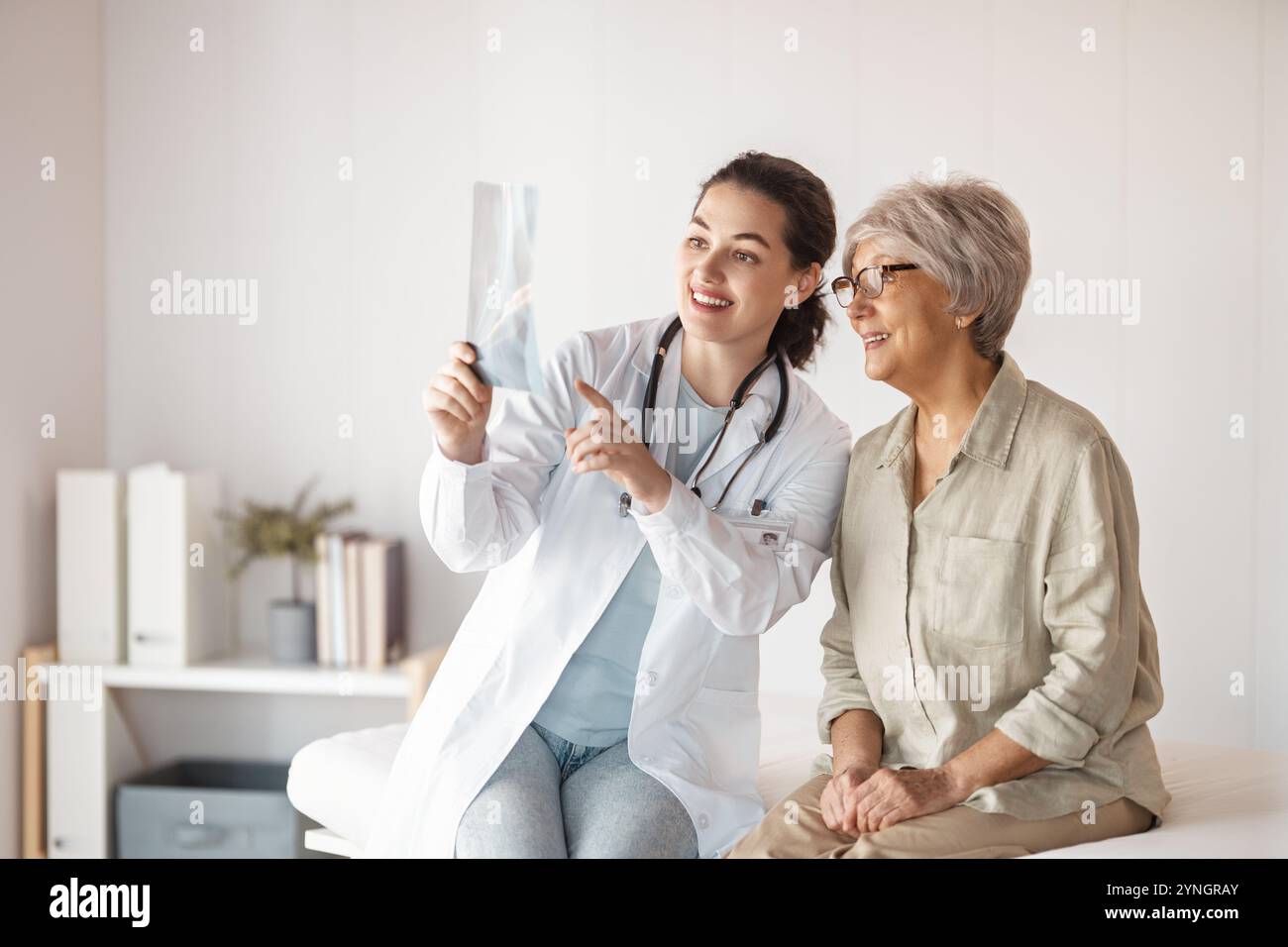 Female patient listening to a doctor in hospital Stock Photo - Alamy