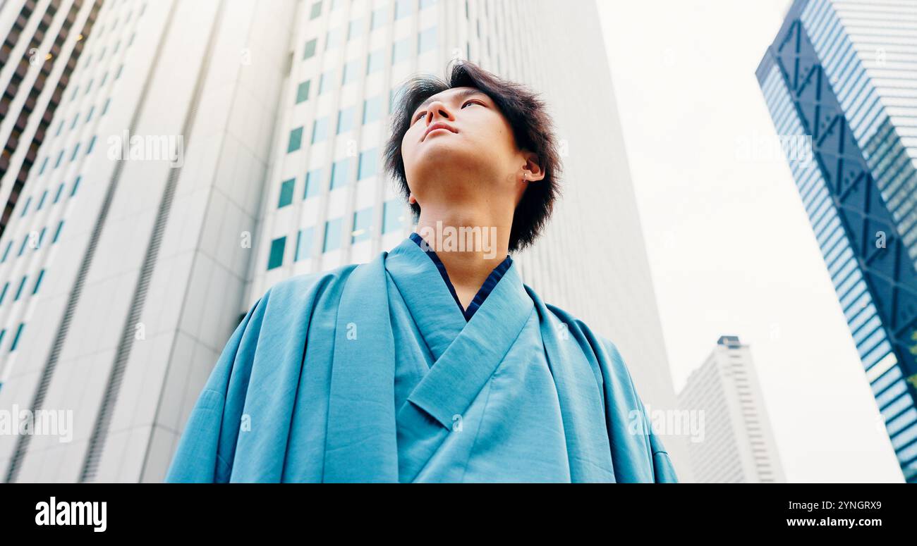 Japanese man, thinking and city travel with traditional clothes, outfit ...