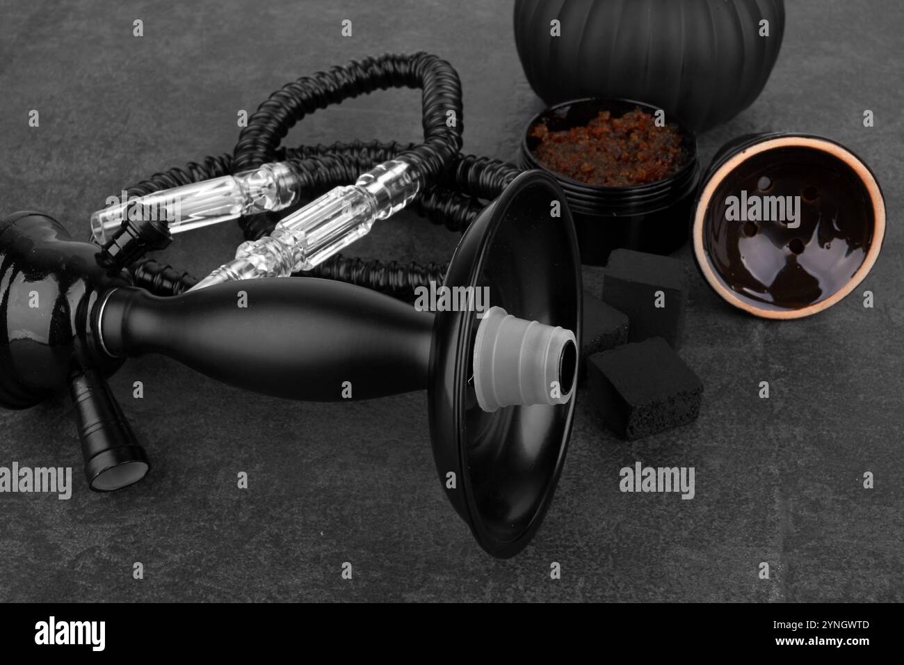 Black hookah on a black stone surface Stock Photo - Alamy