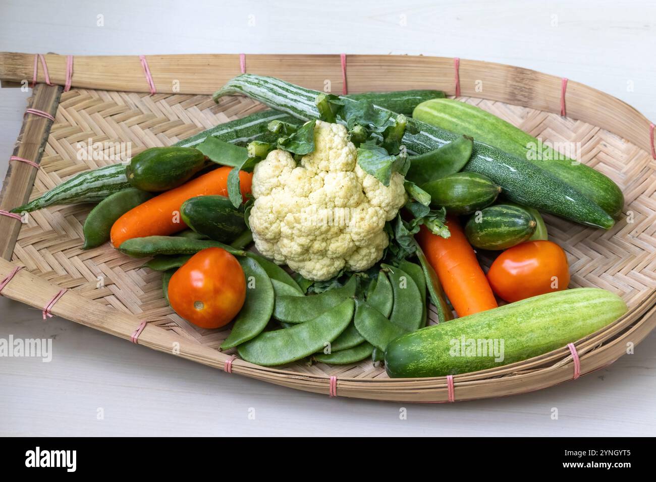 A traditional bamboo cane-woven Kula or Kulo filled with fresh ...