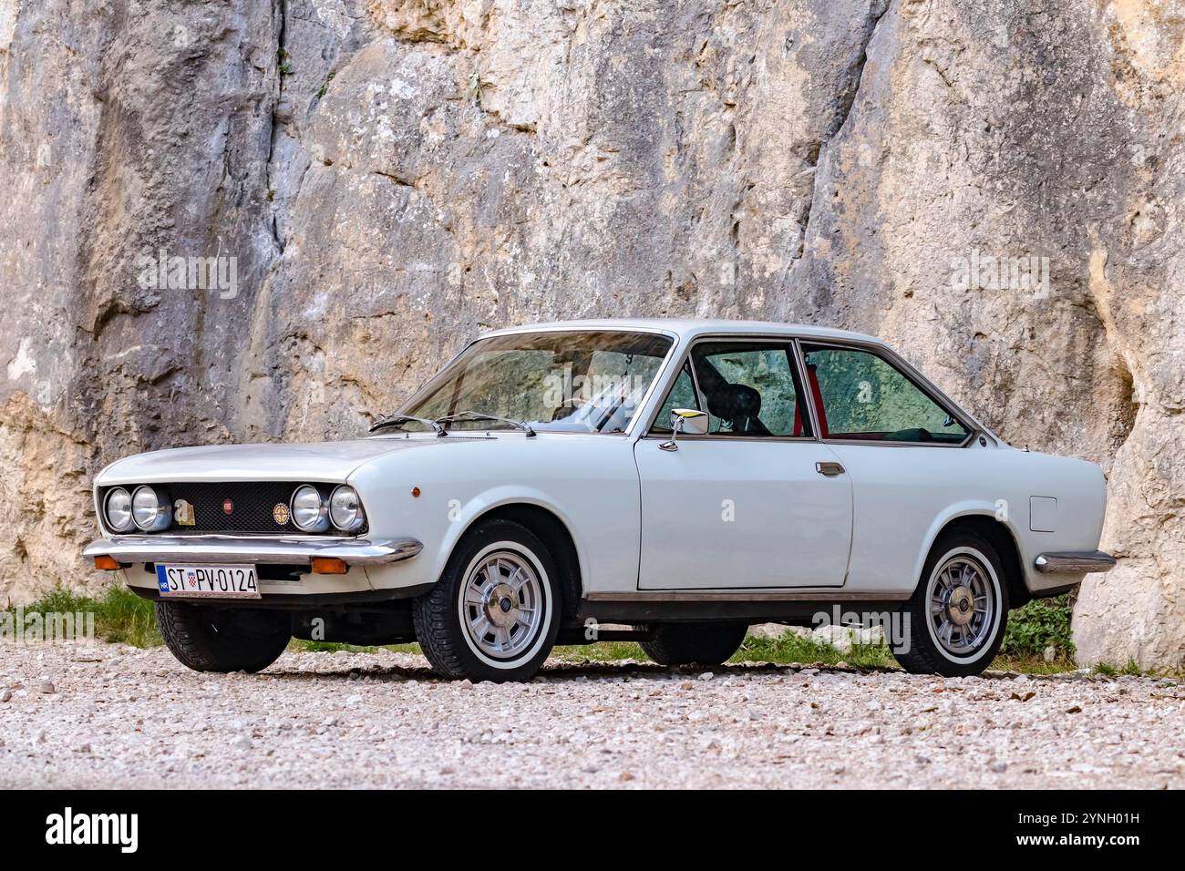 Classical Fiat 124 Sport Coupe on the road. Two-door, four-seater coupé ...