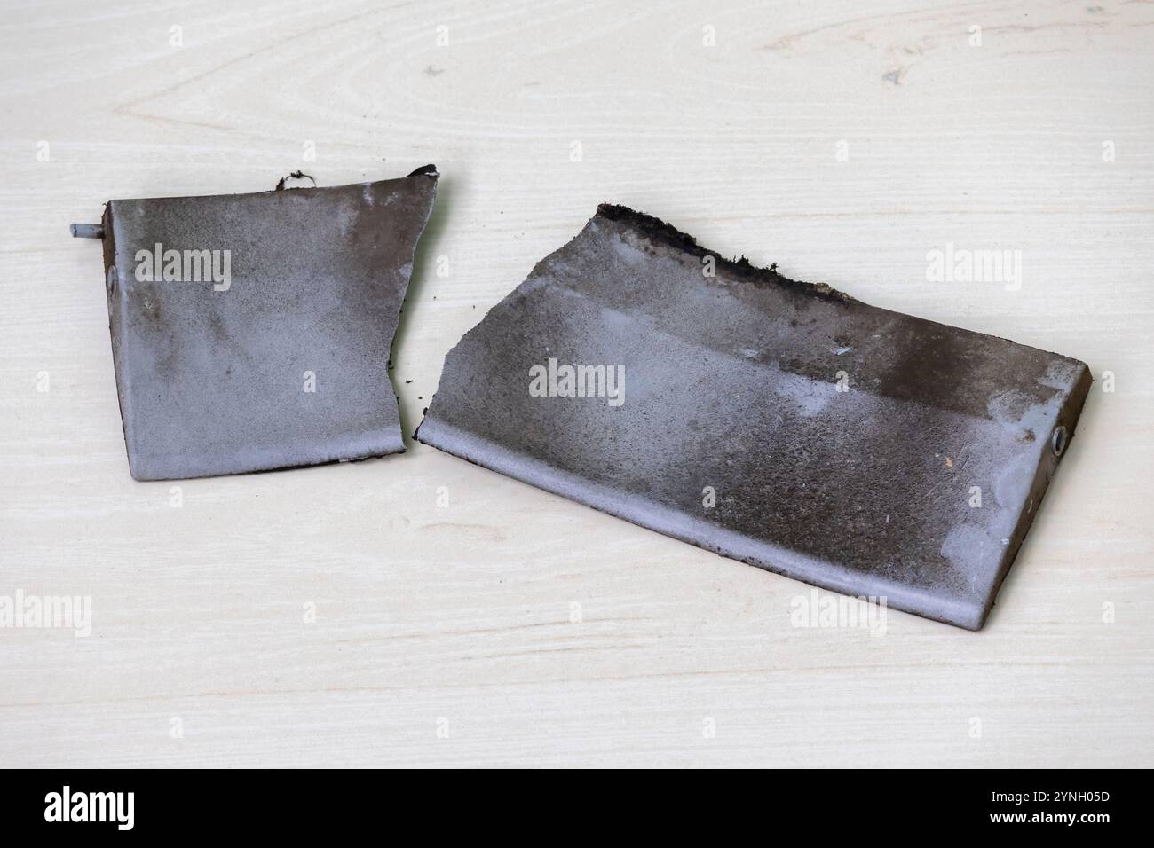 Broken parts of old kitchen exhaust fan. It has become dirty because it ...