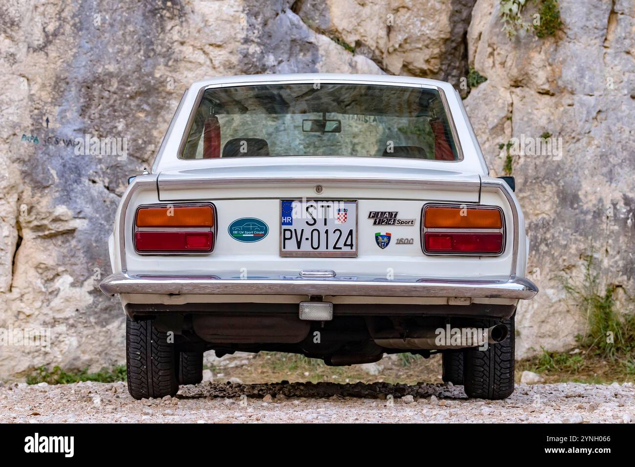 Classical Fiat 124 Sport Coupe on the road. Two-door, four-seater coupé ...
