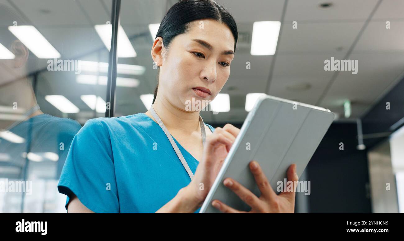 Nurse, tablet and healthcare tech of Japanese woman with thinking, web ...
