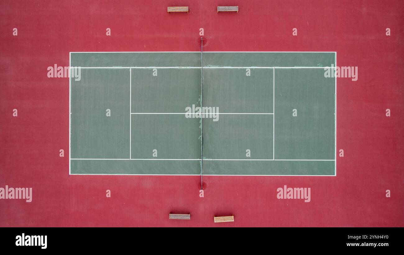 A tennis court with a net and two benches Stock Photo - Alamy