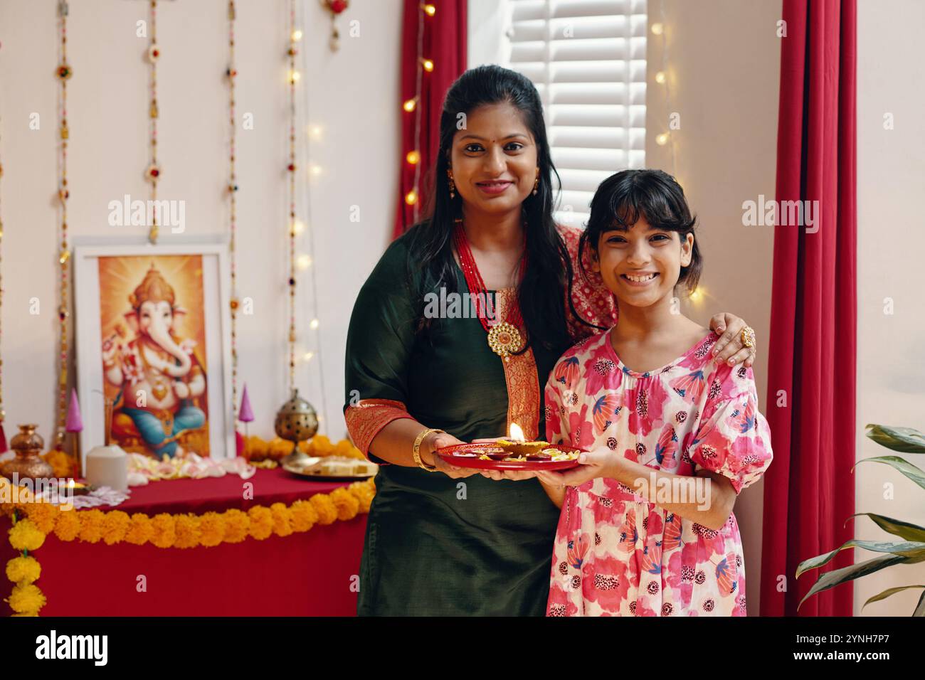 Celebrating Traditional Indian Festival at Home with Family Stock Photo ...