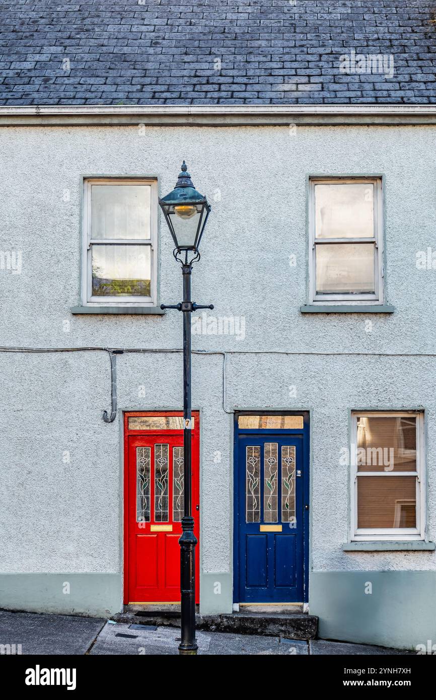 A picturesque street scene in a small town featuring colorful buildings ...