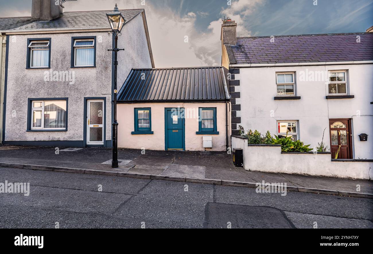 A picturesque street scene in a small town featuring colorful buildings ...