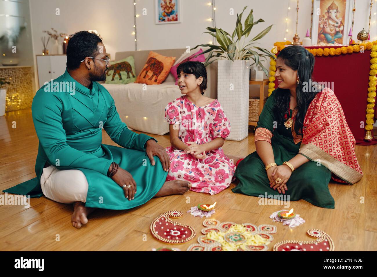 Ethnic family celebrating a tradition hi-res stock photography and ...