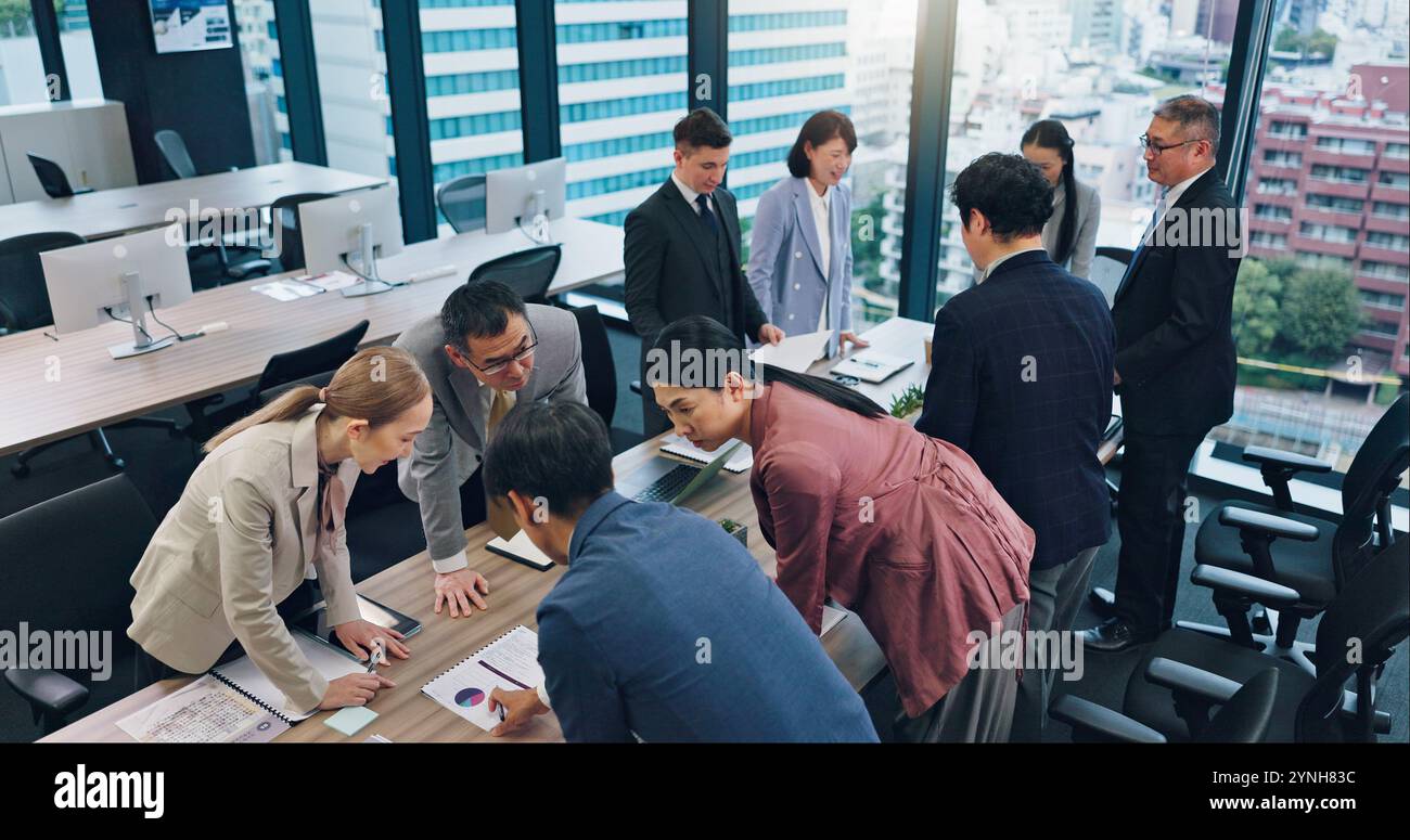 Employees, accounting paperwork and office meeting for review ...