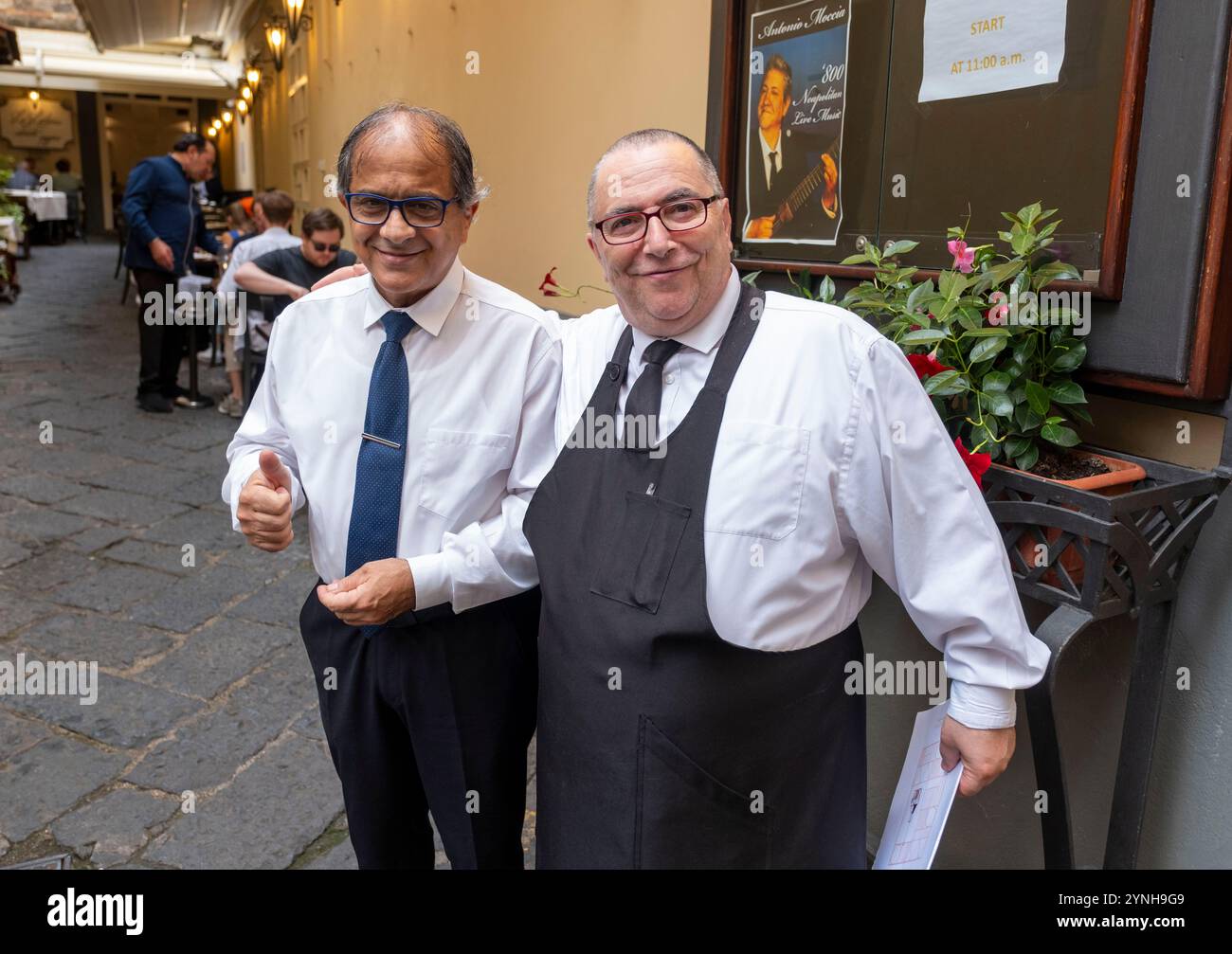 Two waiters pose for the camera outside a restaurant in Sorrento Italy ...