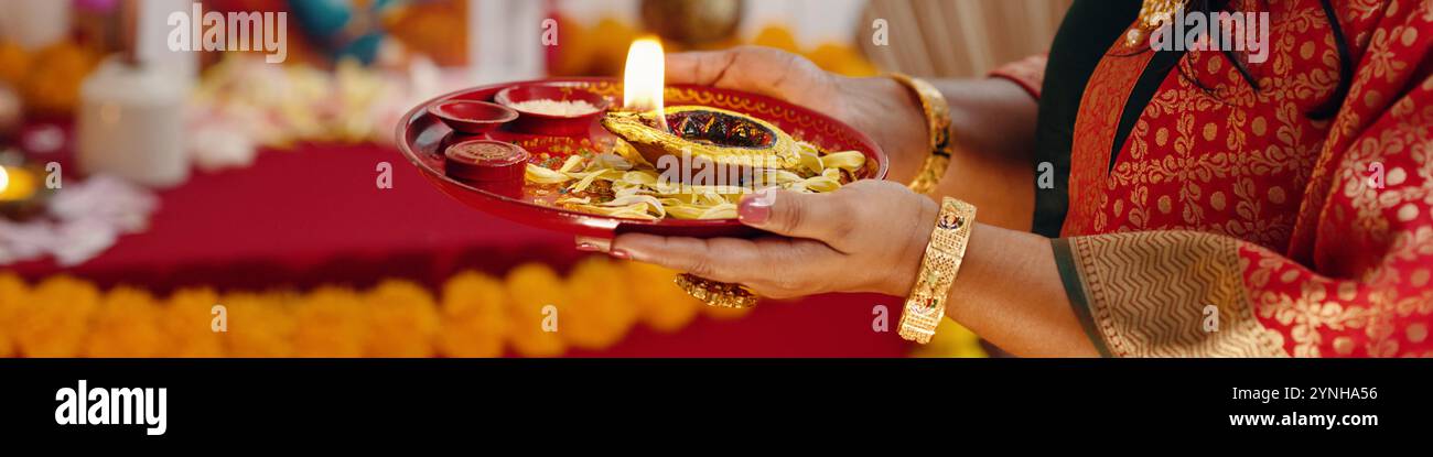 Holding Traditional Diya Plate During Indian Festival Stock Photo - Alamy