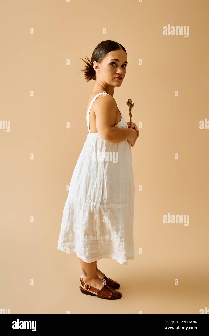 A confident young woman with short stature poses beautifully in a ...