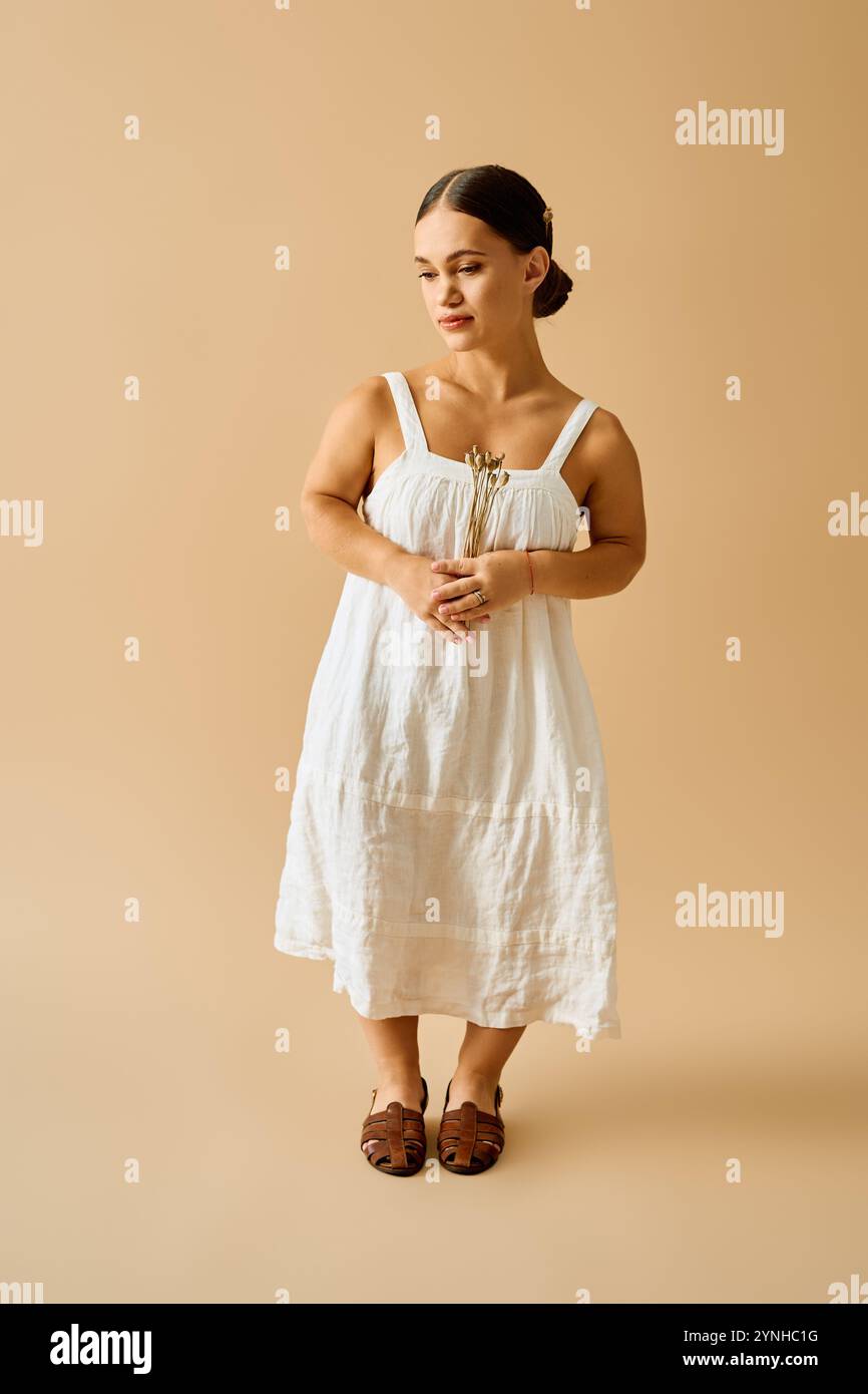 Captivating young woman with short stature models a beautiful dress in ...