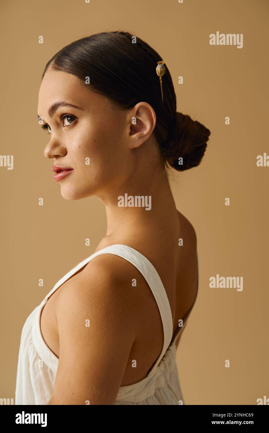 Short-statured model exudes elegance in a stunning dress against a soft ...