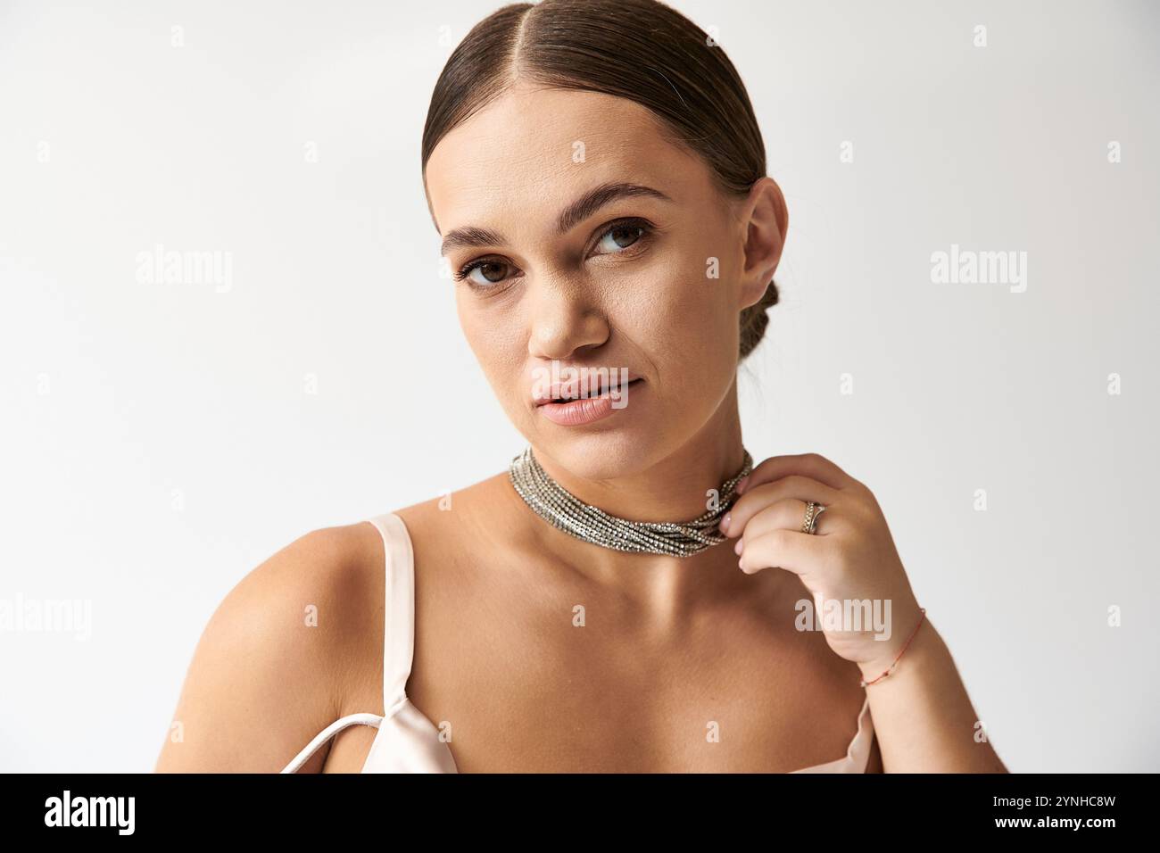 Young woman with short stature models an elegant dress, celebrating ...