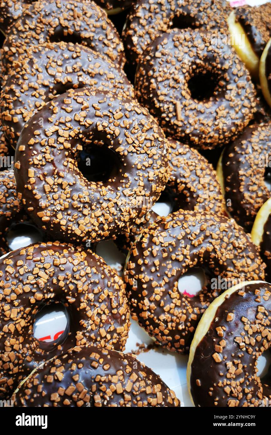 chocolate donuts texture as very nice food background Stock Photo - Alamy