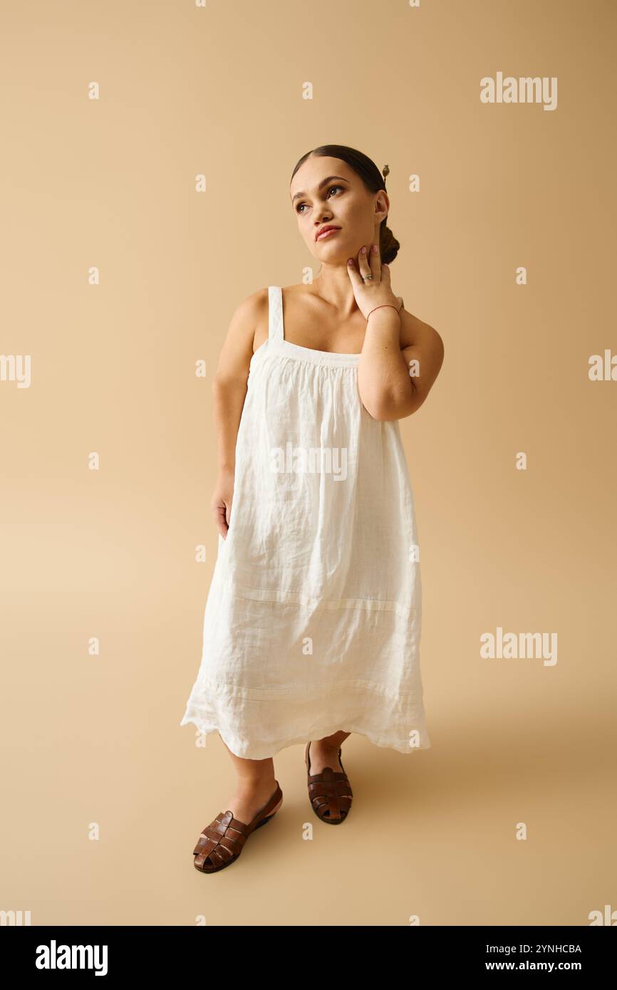 Young woman with short stature showcases an elegant style in a studio ...
