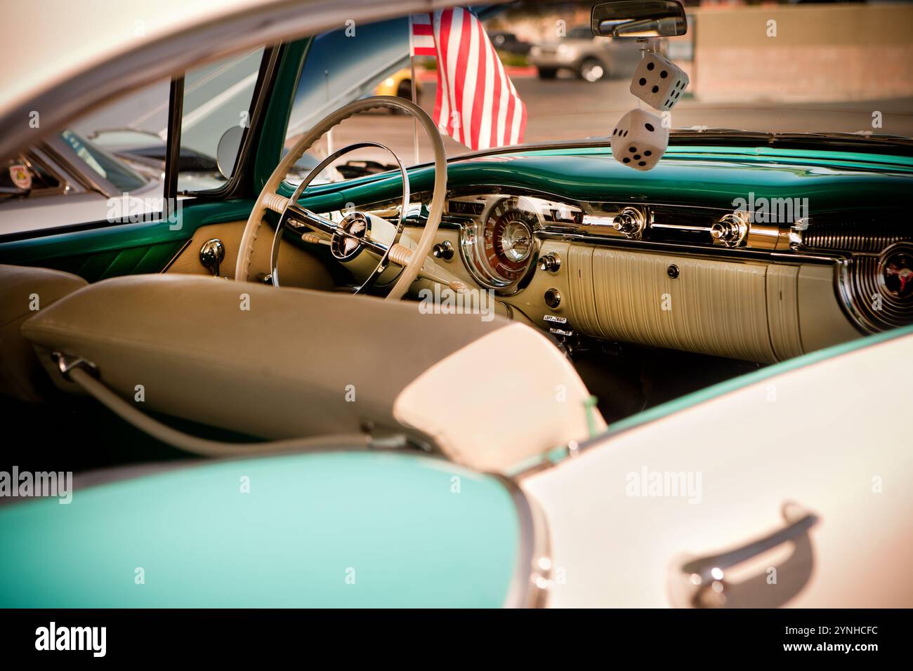 The interior, dashboard and steering wheel of a classic american car ...